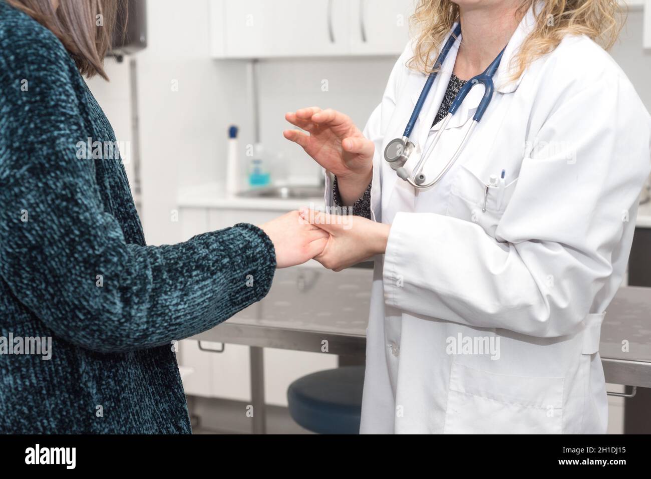 Doctor comforting a patient while discussing treatment . Medicine and ...