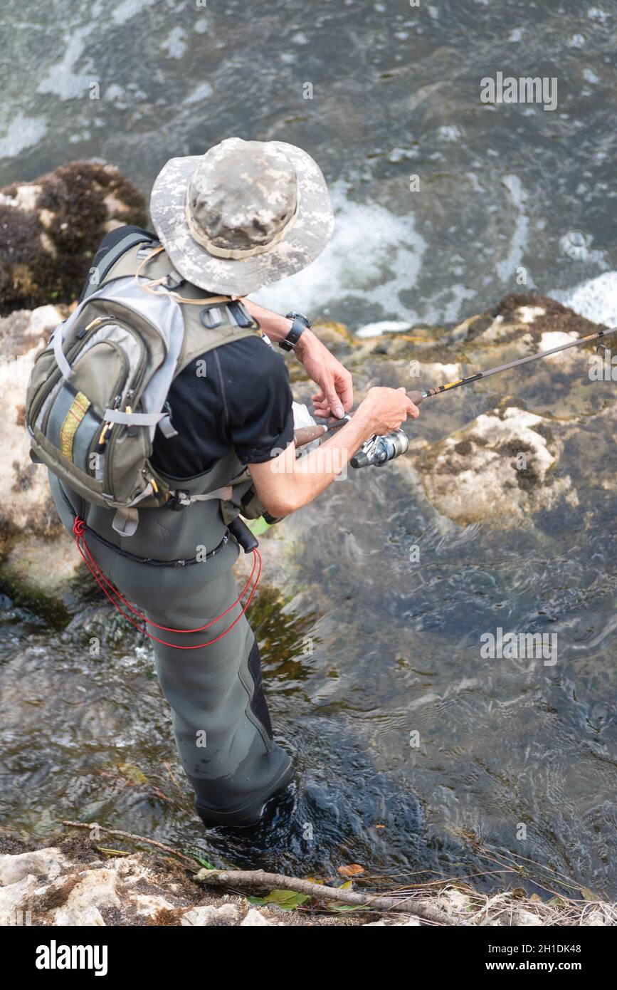 Aerial view of sport Fisher fishing in the river Stock Photo - Alamy