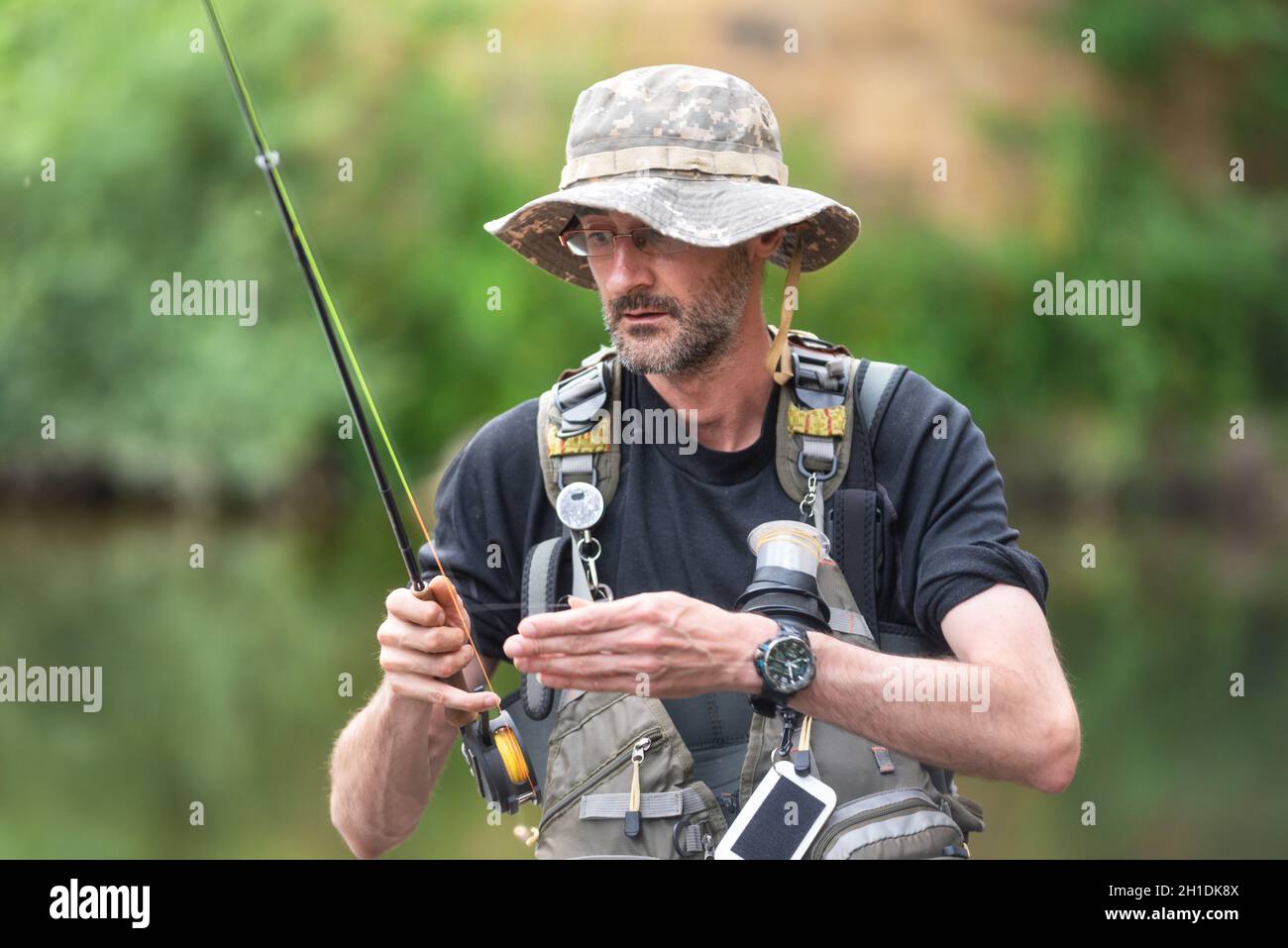 Pro fishermen with fishing rod, hobby and sport activity Stock Photo ...