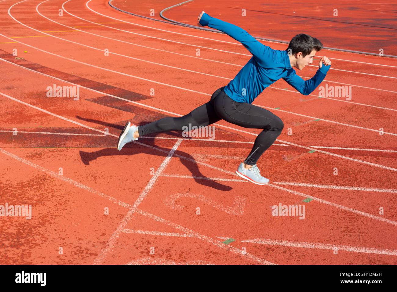 Runner starting his sprint on running track in a stadium Stock Photo ...