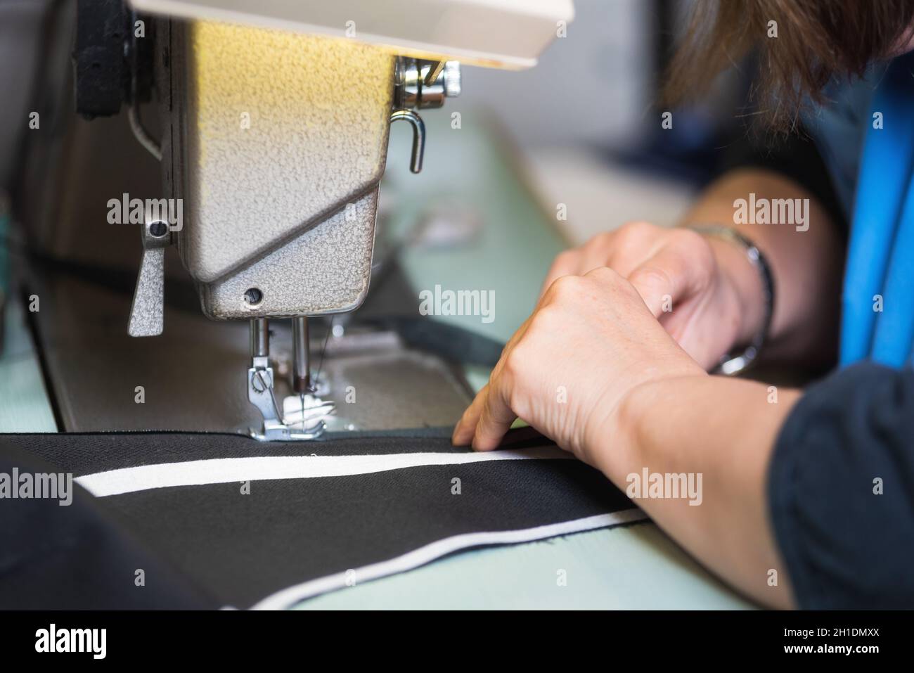 Woman working electric sewing machine hi-res stock photography and ...