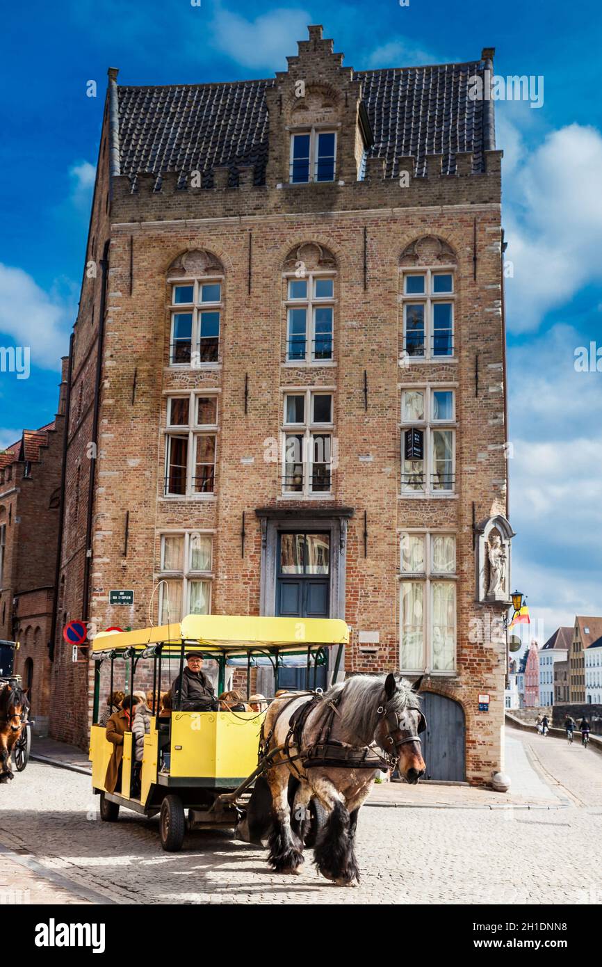 BRUGES, BELGIUM - MARCH, 2018: People touring around the beautiful ...
