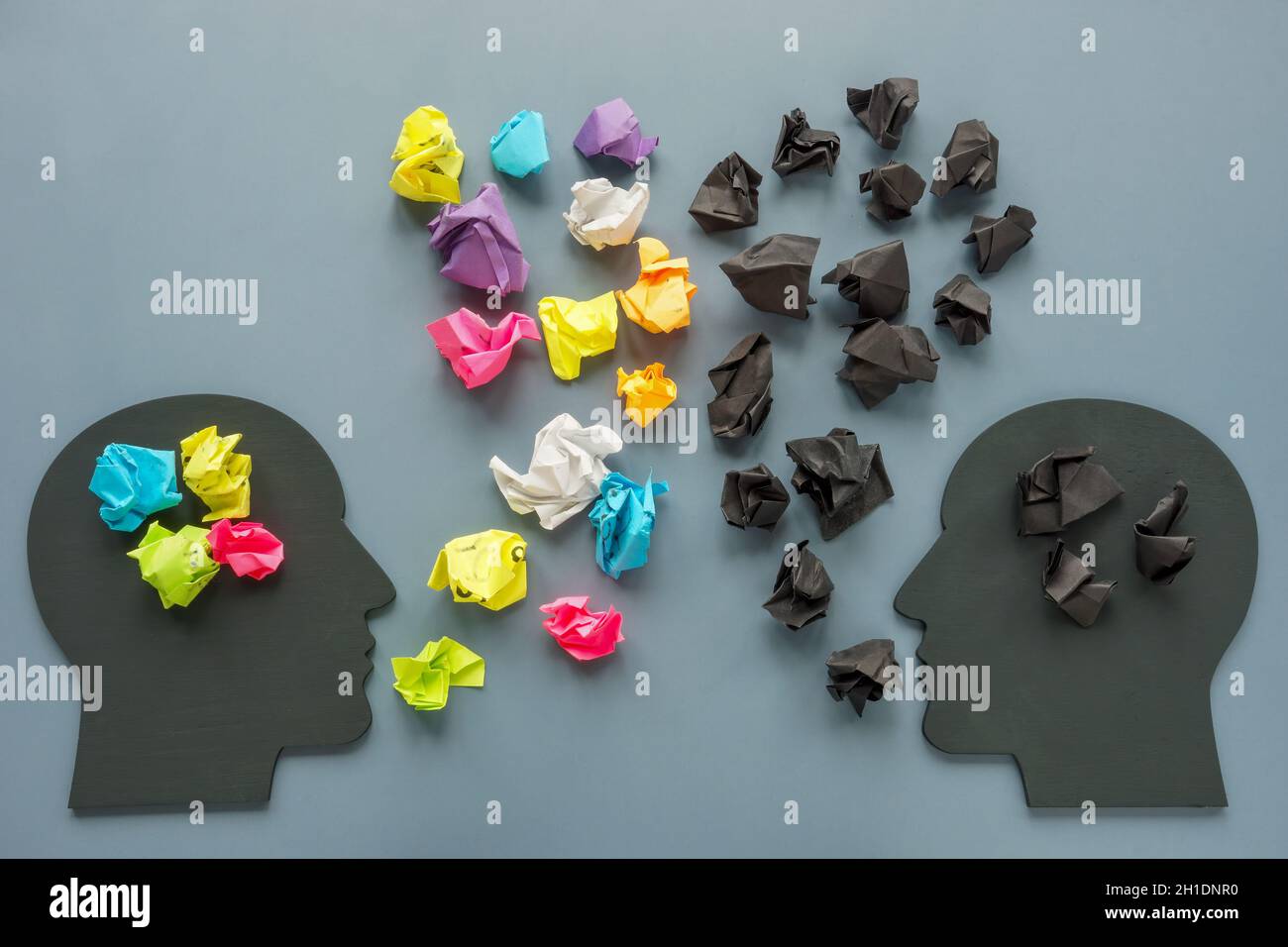 Positive and negative thinking concept. Figures of heads and paper ...