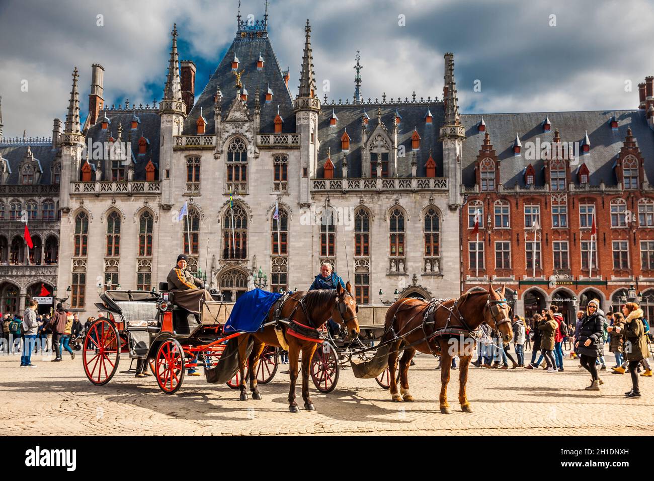 BRUGES, BELGIUM - MARCH, 2018: Carriage pulled by a horse at the ...