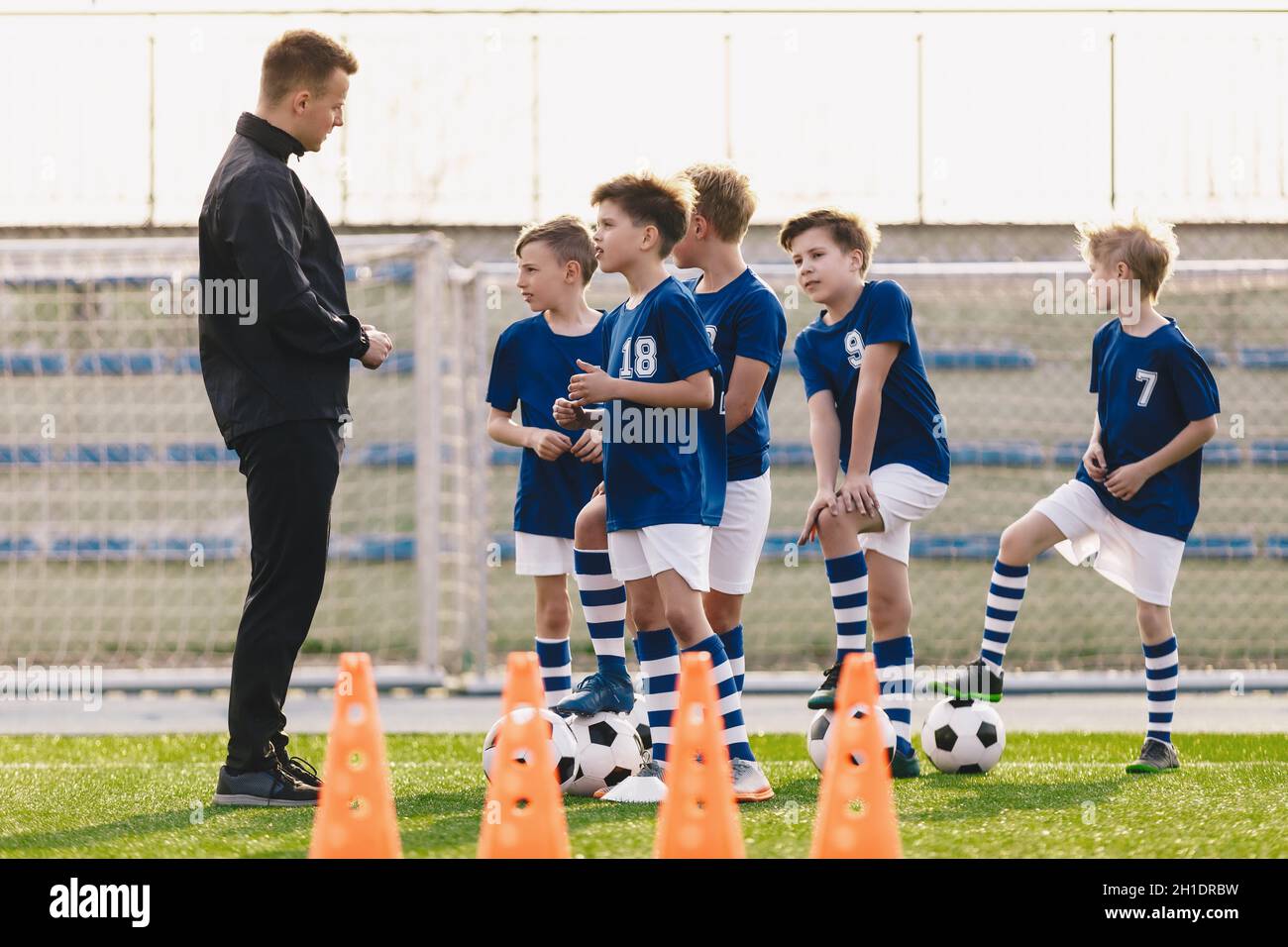 Soccer coach teaching young player hi-res stock photography and images ...