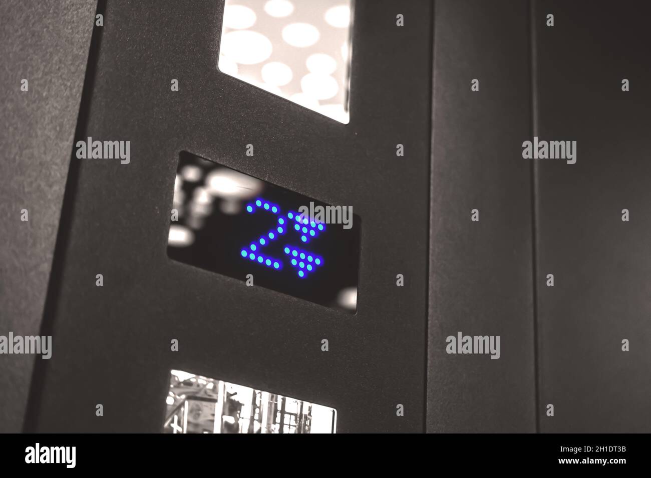 Modern elevator moving down with led screen panel. Buildings with ...