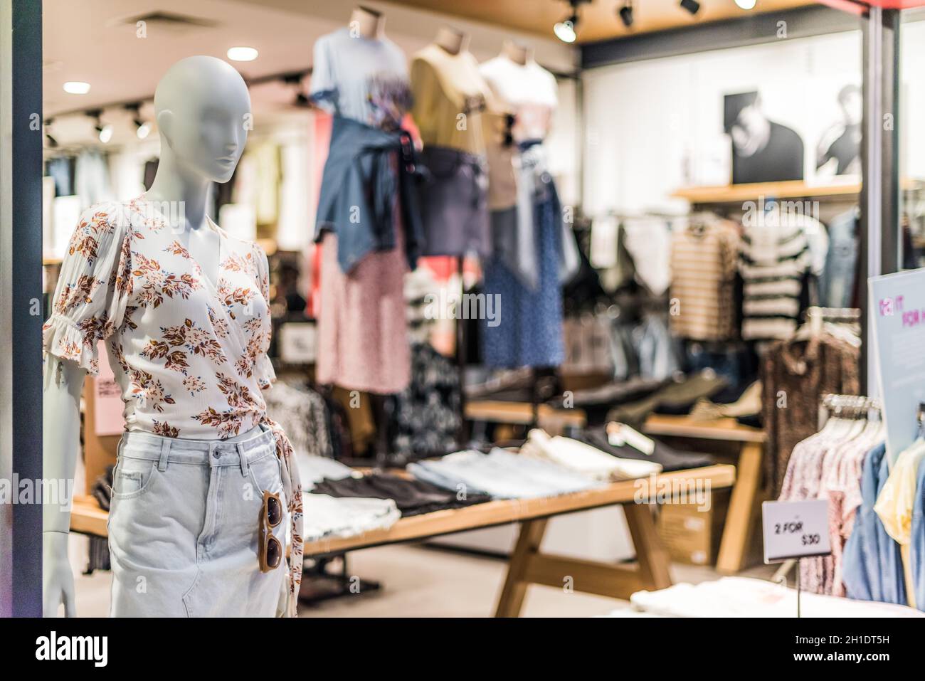 SINGAPORE - MAR 4, 2020: Interior of fashion store with mannequins ...