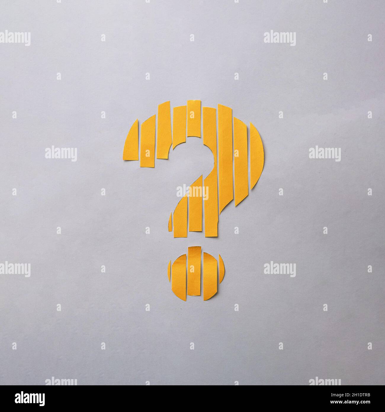 Creative minimal question mark made from yellow stripes on gray ...