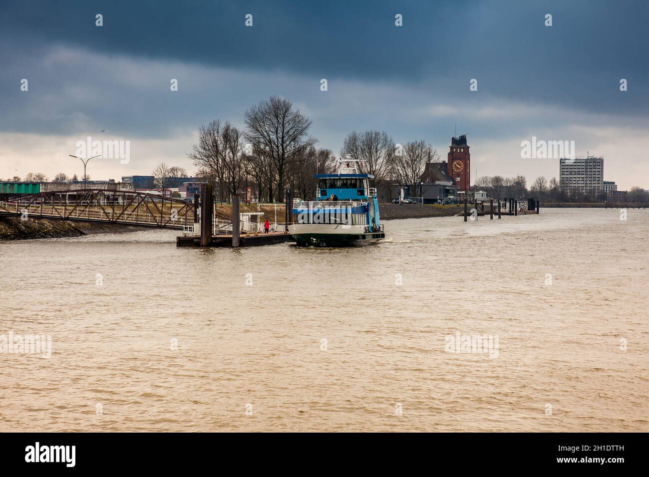 HAMBURG, GERMANY - MARCH, 2018: Ferry navigating on the Elbe river in a ...