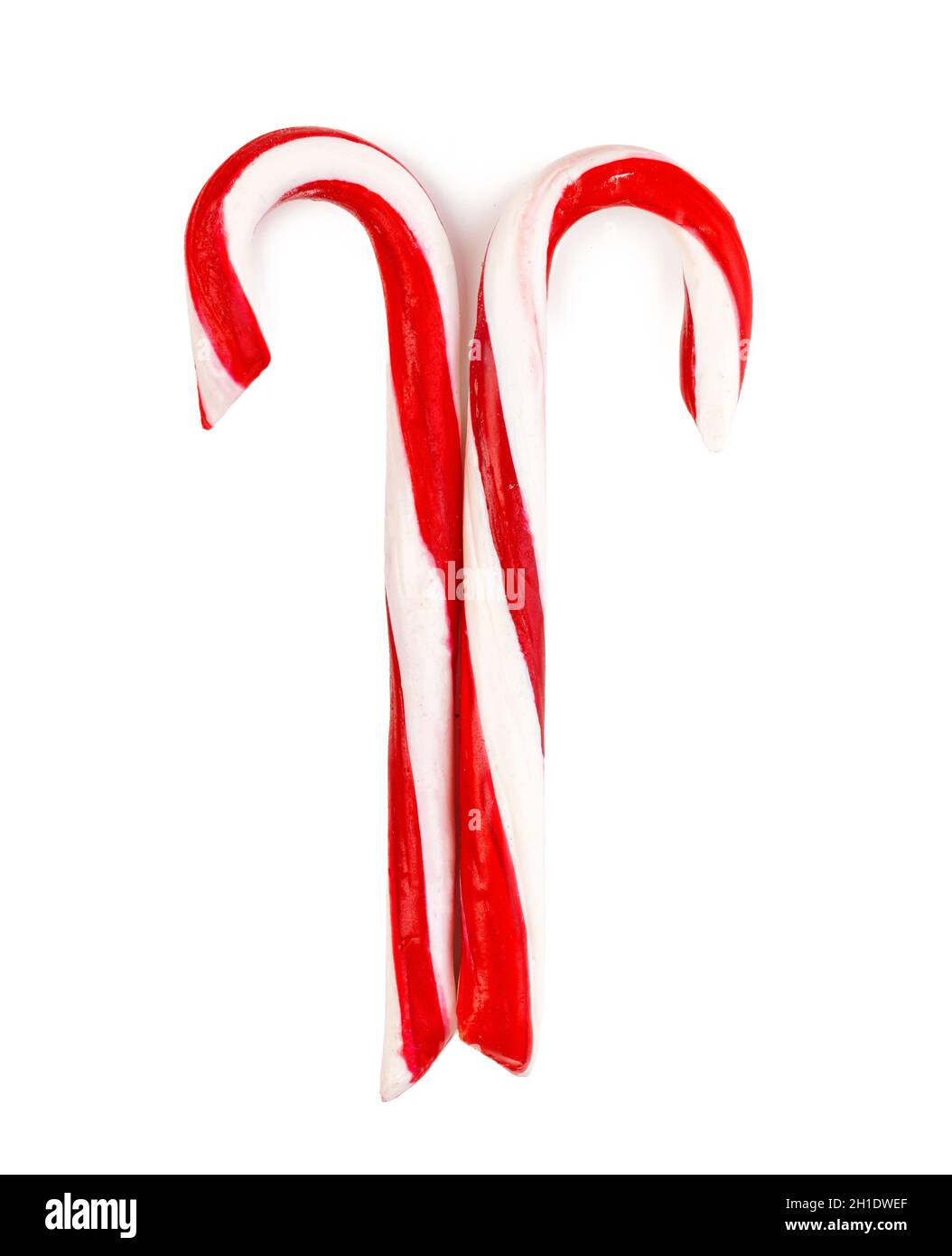 Two candy canes isolated on white background Stock Photo - Alamy