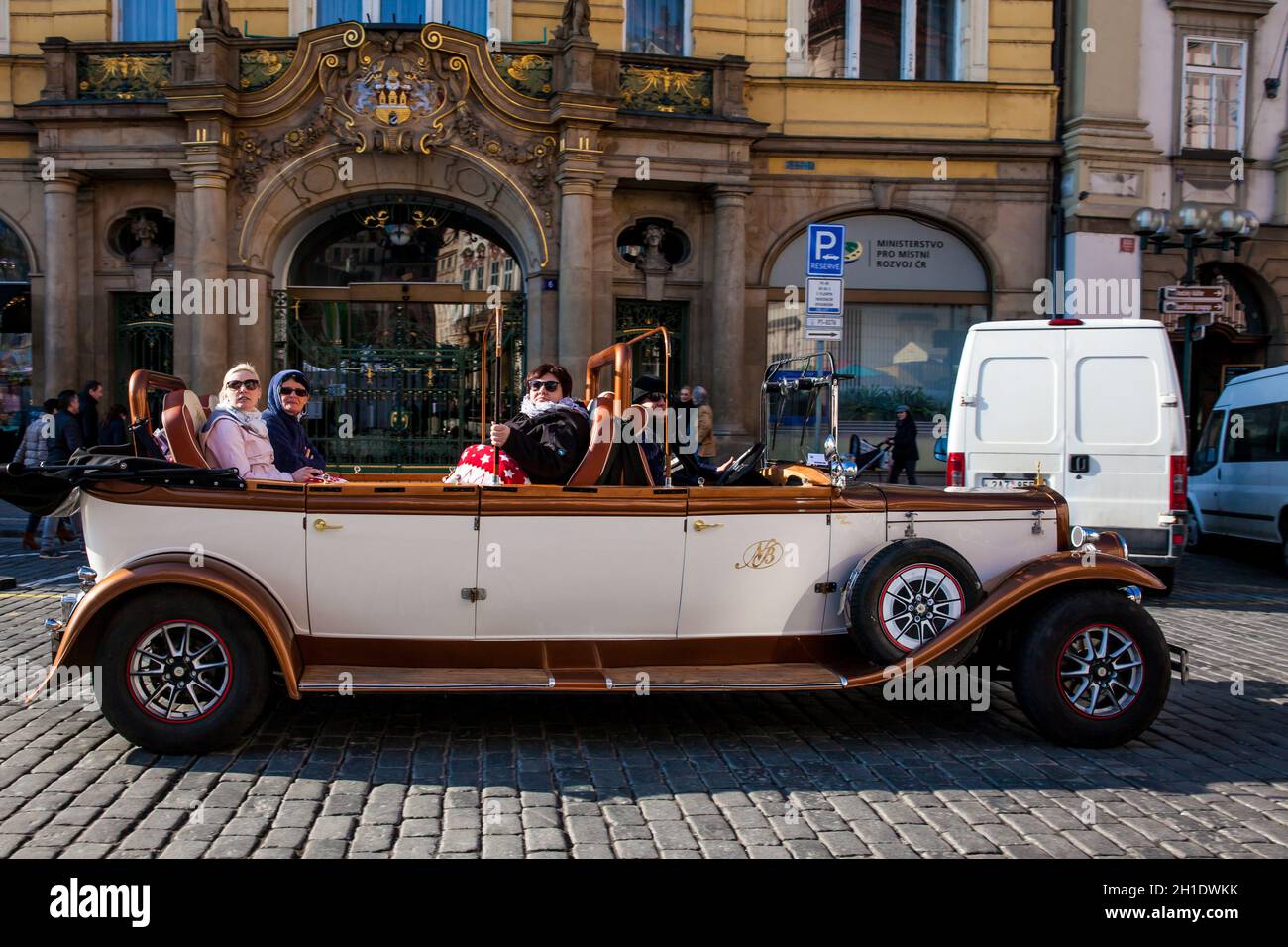 PRAGUE, CZECH REPUBLIC - APRIL, 2018: Tourists at a city tour on a ...