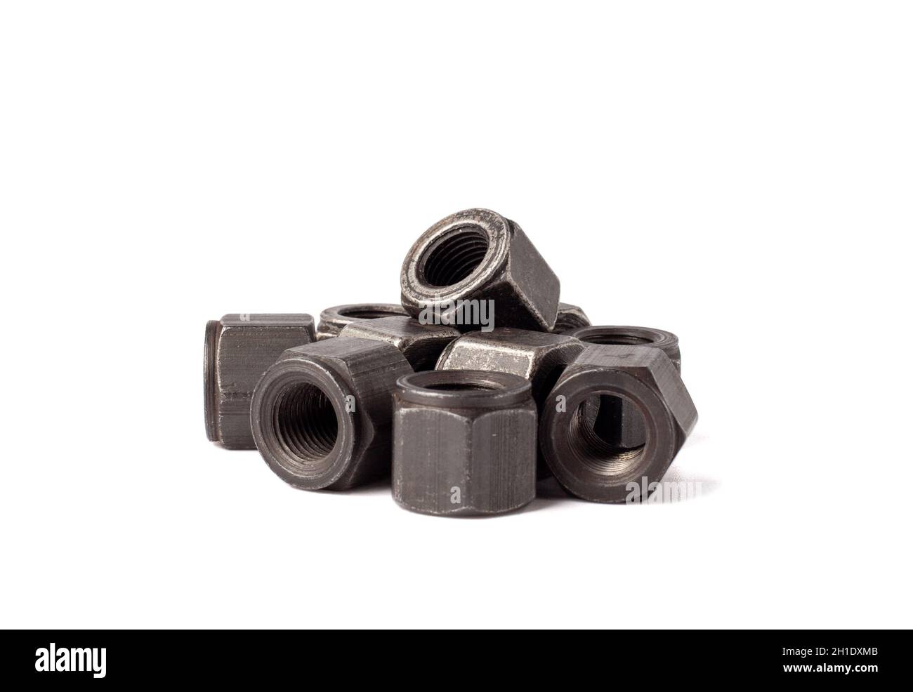 bunch of metallic nuts isolated on white background. Heavy hex nut ...