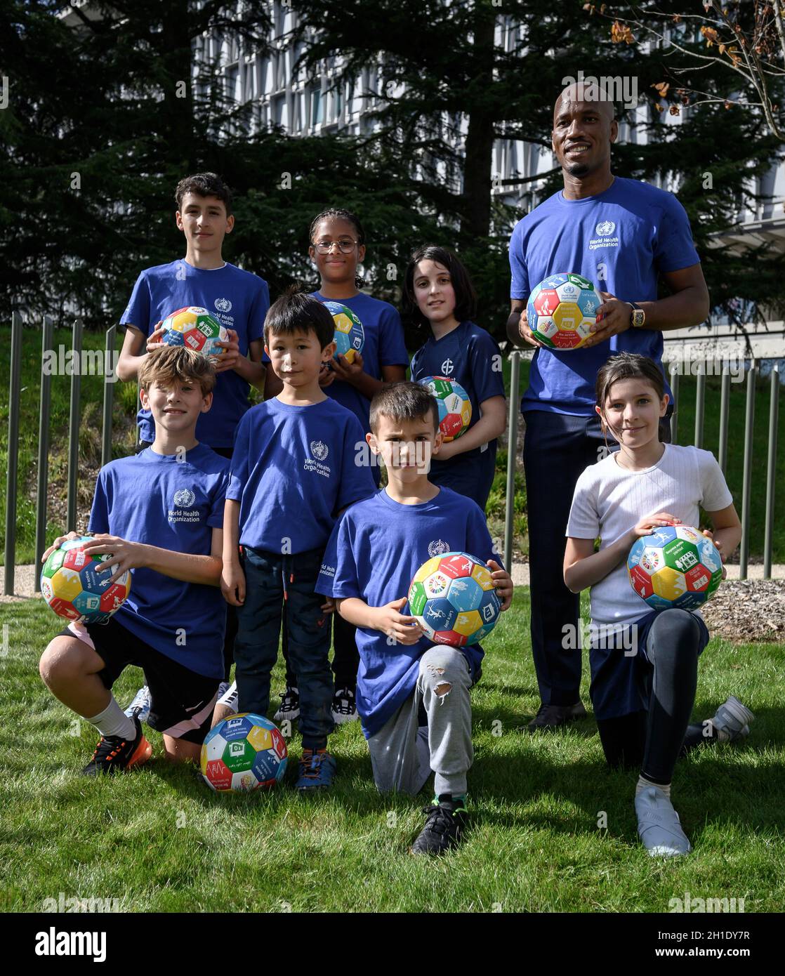 Football legend Didier Drogba poses with children after being appointed ...