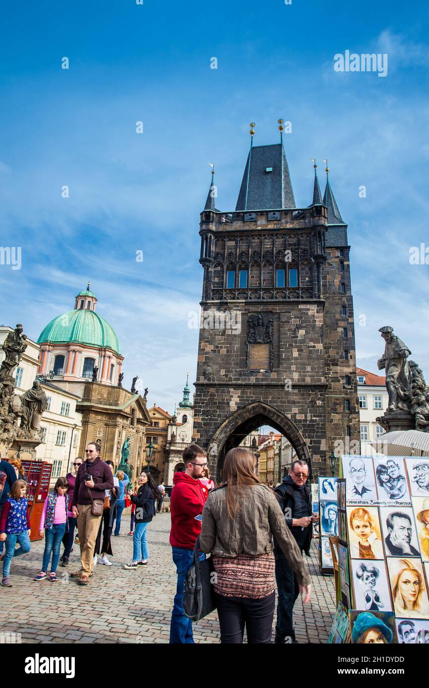 PRAGUE, CZECH REPUBLIC - APRIL, 2018: Tourists and artists at the ...