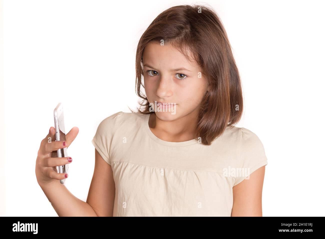 Paris, France - August 26, 2017: sad little girl holding an iphone with ...
