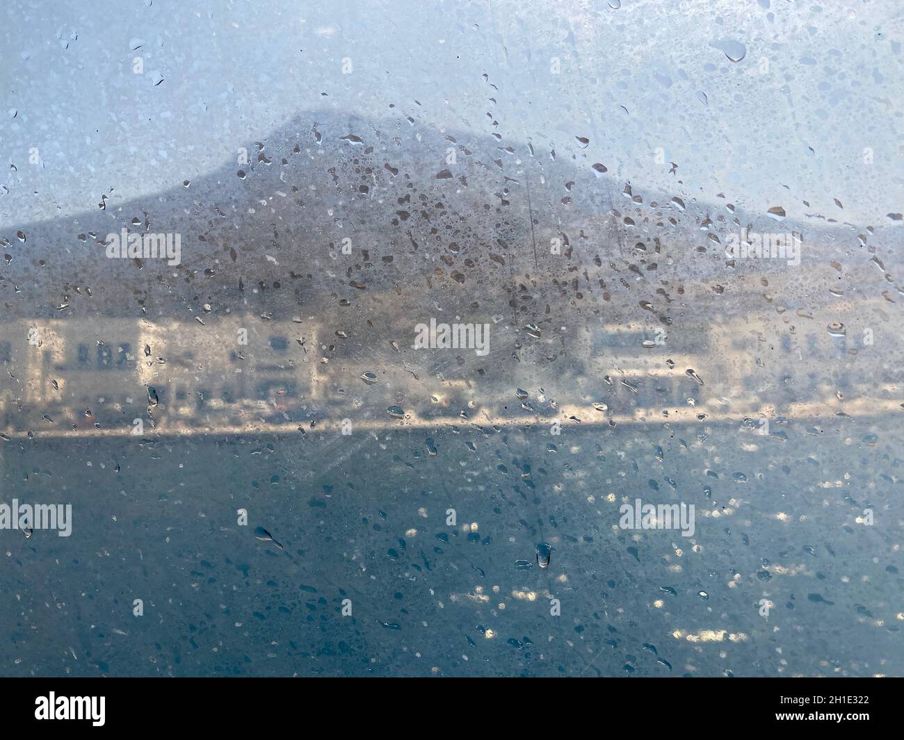 Melancholy coastal view seen through a window boat, Greece island ...