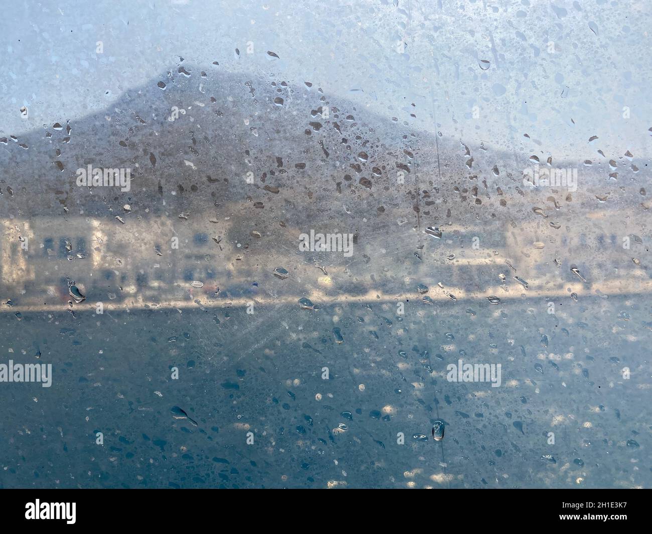 Melancholy coastal view seen through a window boat, Greece island ...