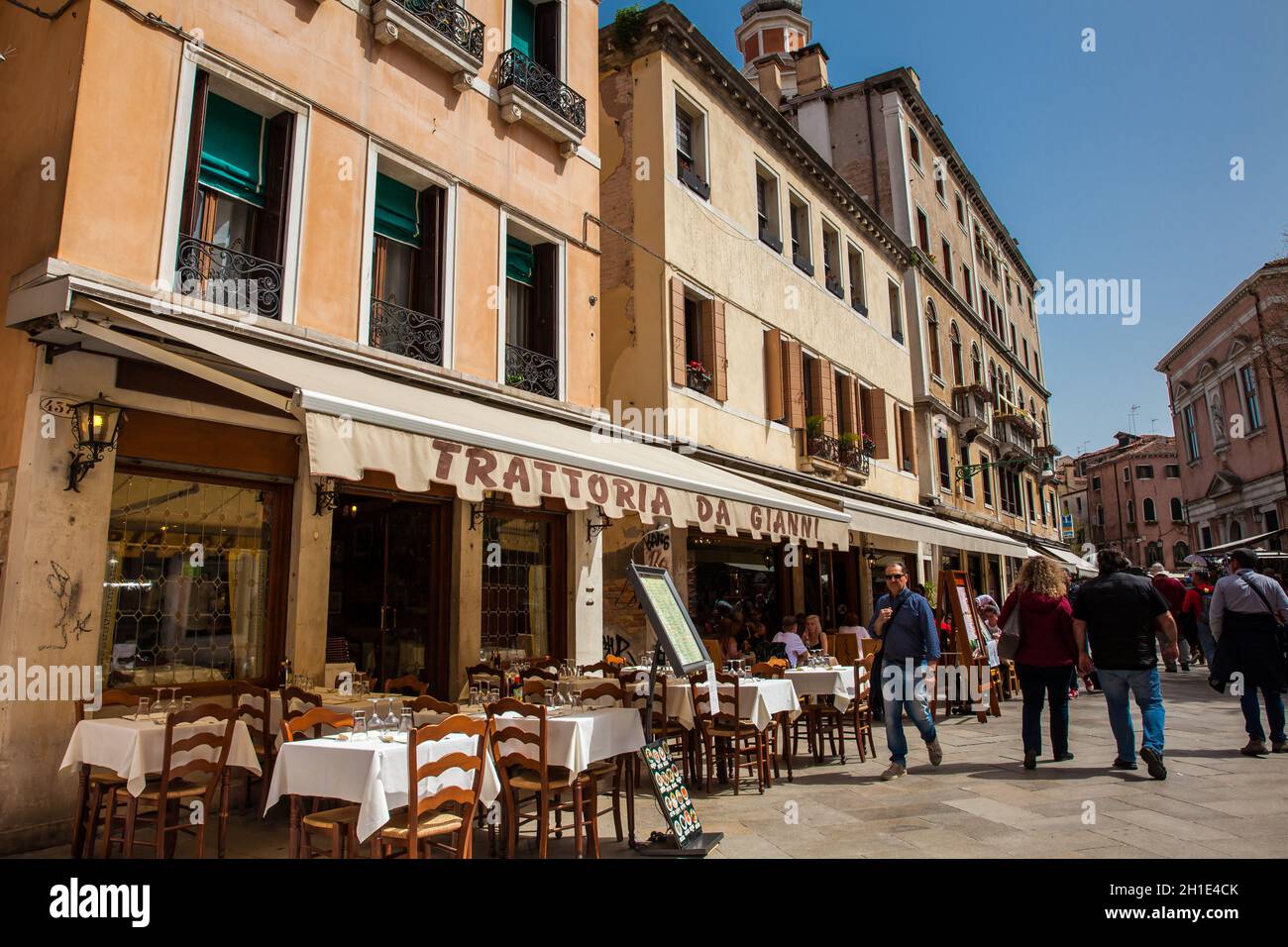 VENICE, ITALY - APRIL, 2018: Tourists and locals walking around the ...