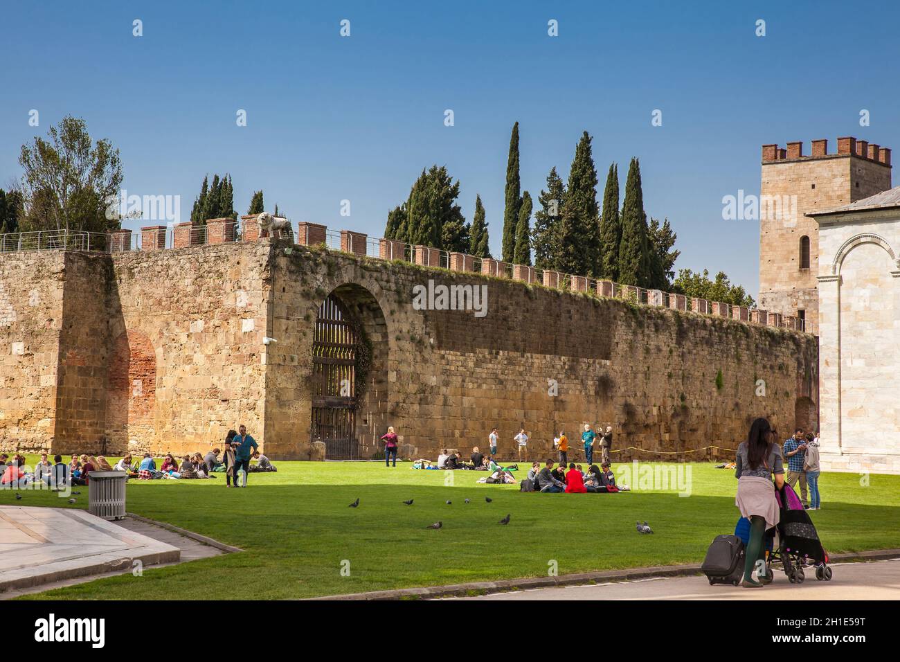 PISA, ITALY - APRIL, 2018: Gate of the Lion and the Saint Mary Tower at ...
