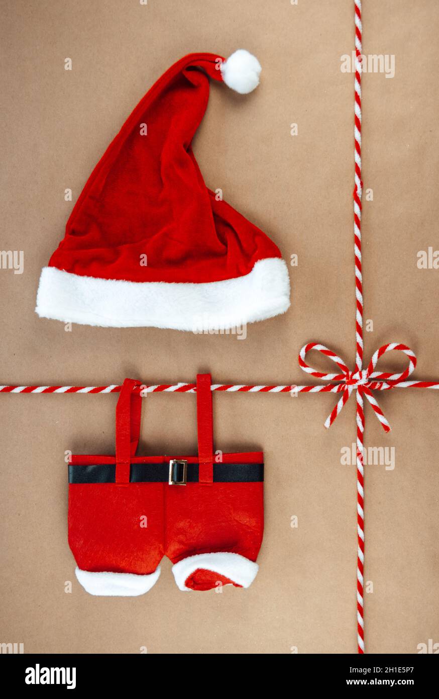 Christmas string or twine tied in a bow on craft paper and Santa Claus ...