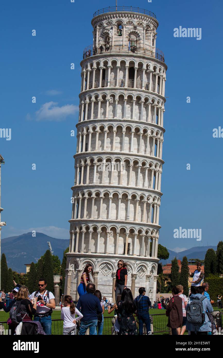 PISA, ITALY - APRIL, 2018: Tourists posing and taking pictures in front ...