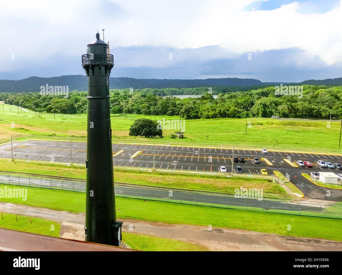View of shore of Panama Canal and lighthouse from cruise ship at Panama ...