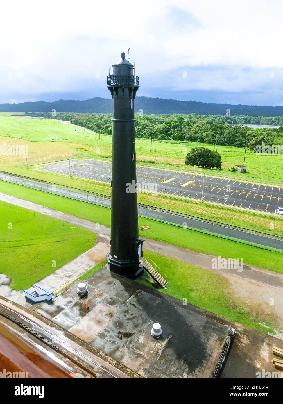 View of shore of Panama Canal and lighthouse from cruise ship at Panama ...