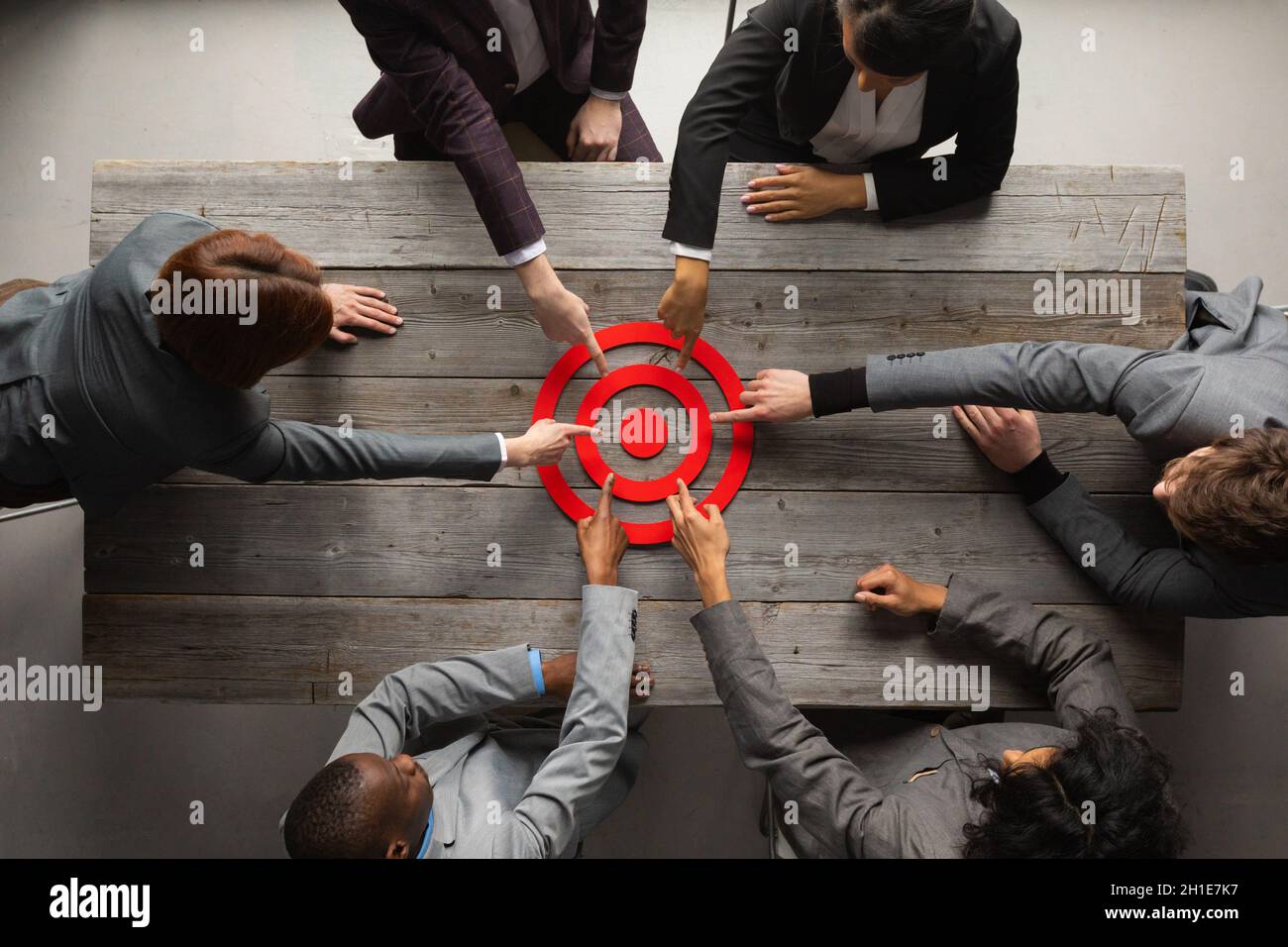 Business people pointing to company goal and yearly target in meeting ...