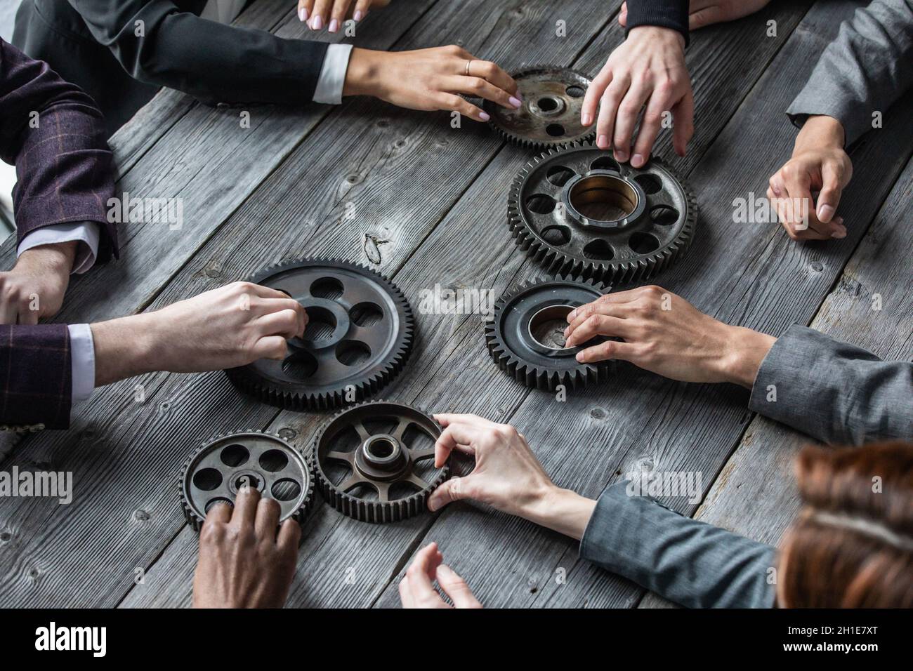 People with gear cogs of business teamwork cooperation concept Stock ...