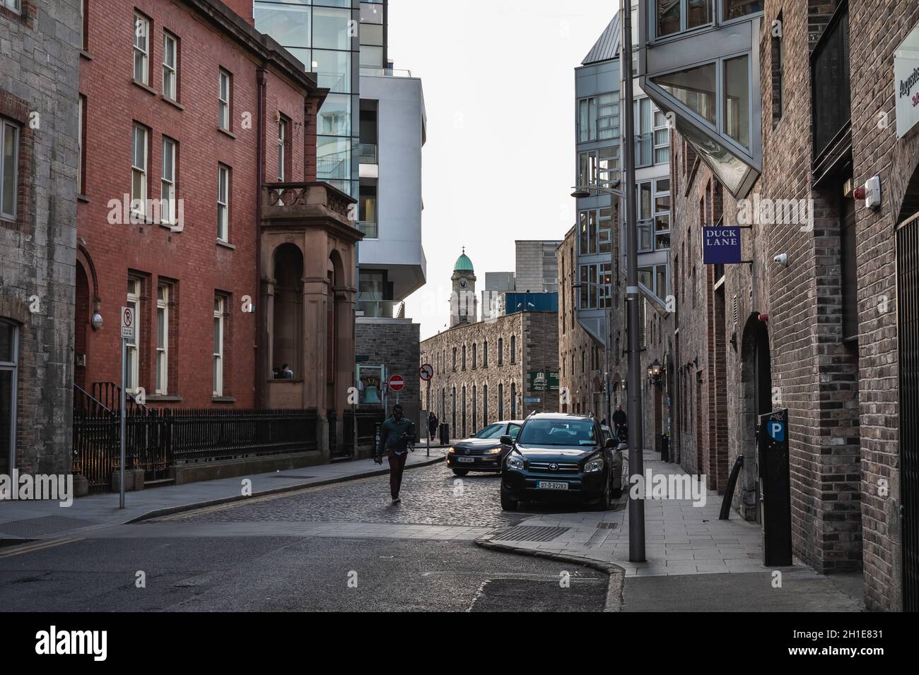 Dublin, Ireland - February 16, 2019: people walking down a small street ...