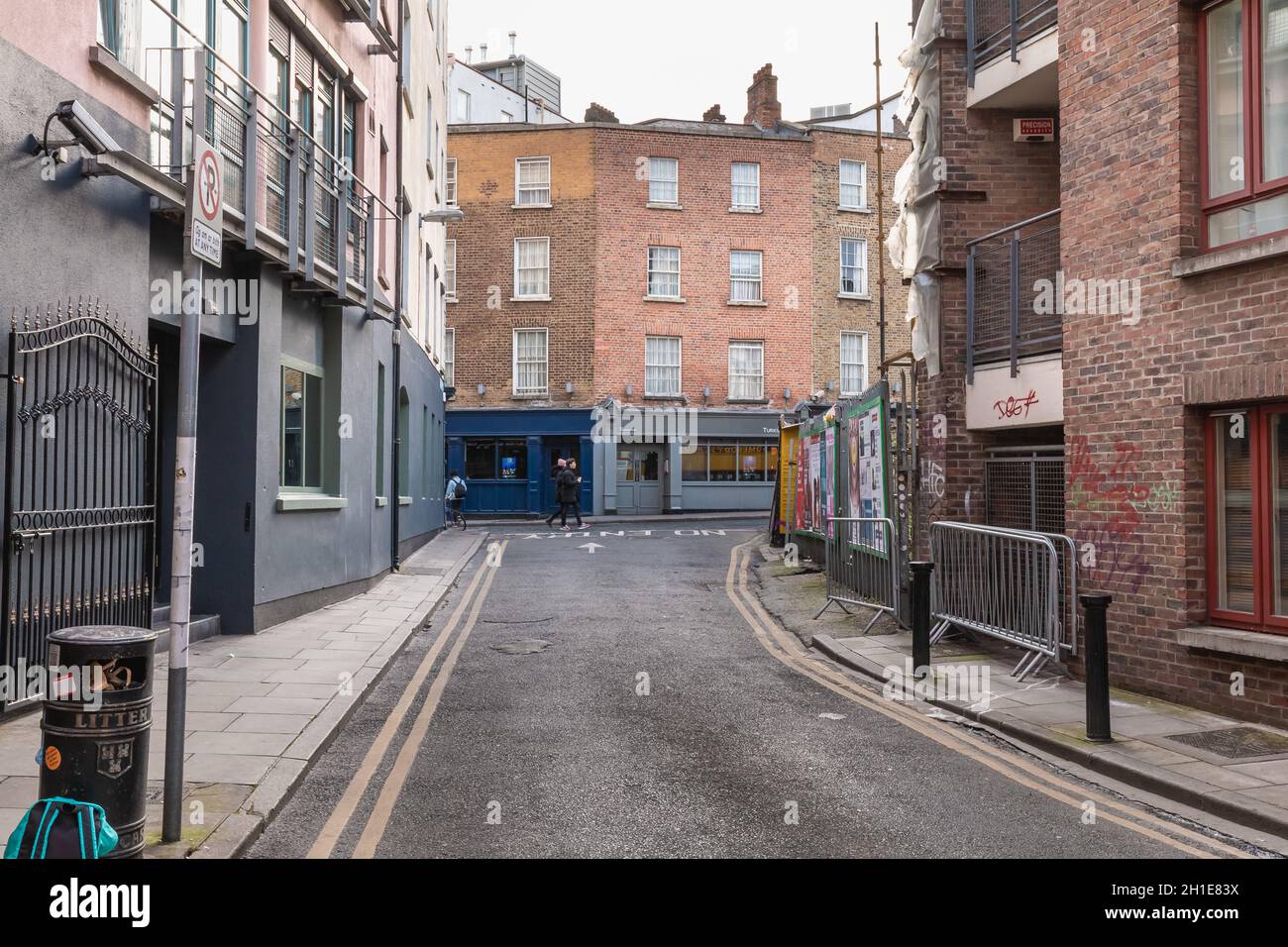 Dublin, Ireland - February 16, 2019: people walking down a small street ...