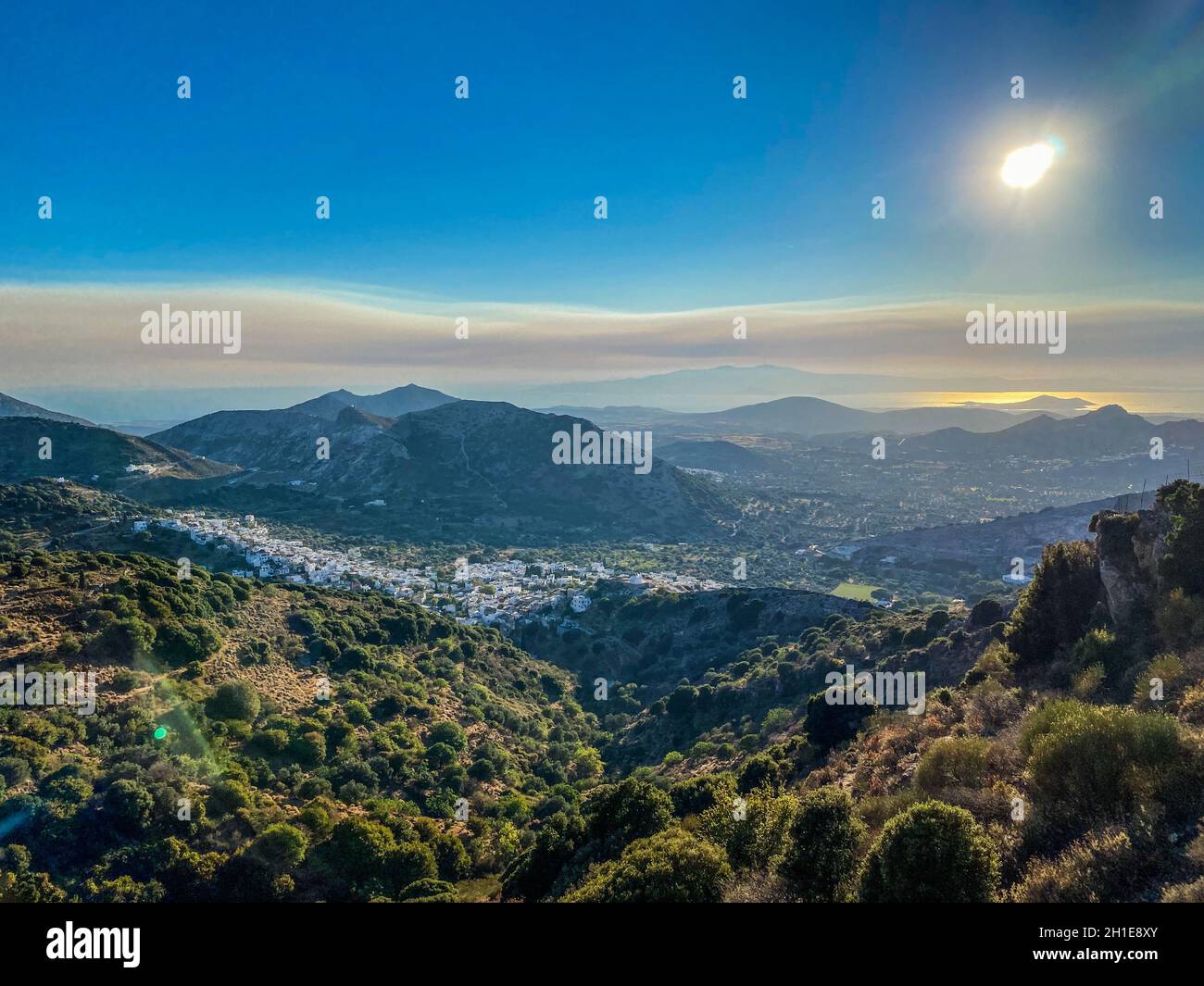 Athene fire smoke on the skyline in the sky of Filoti greek island ...