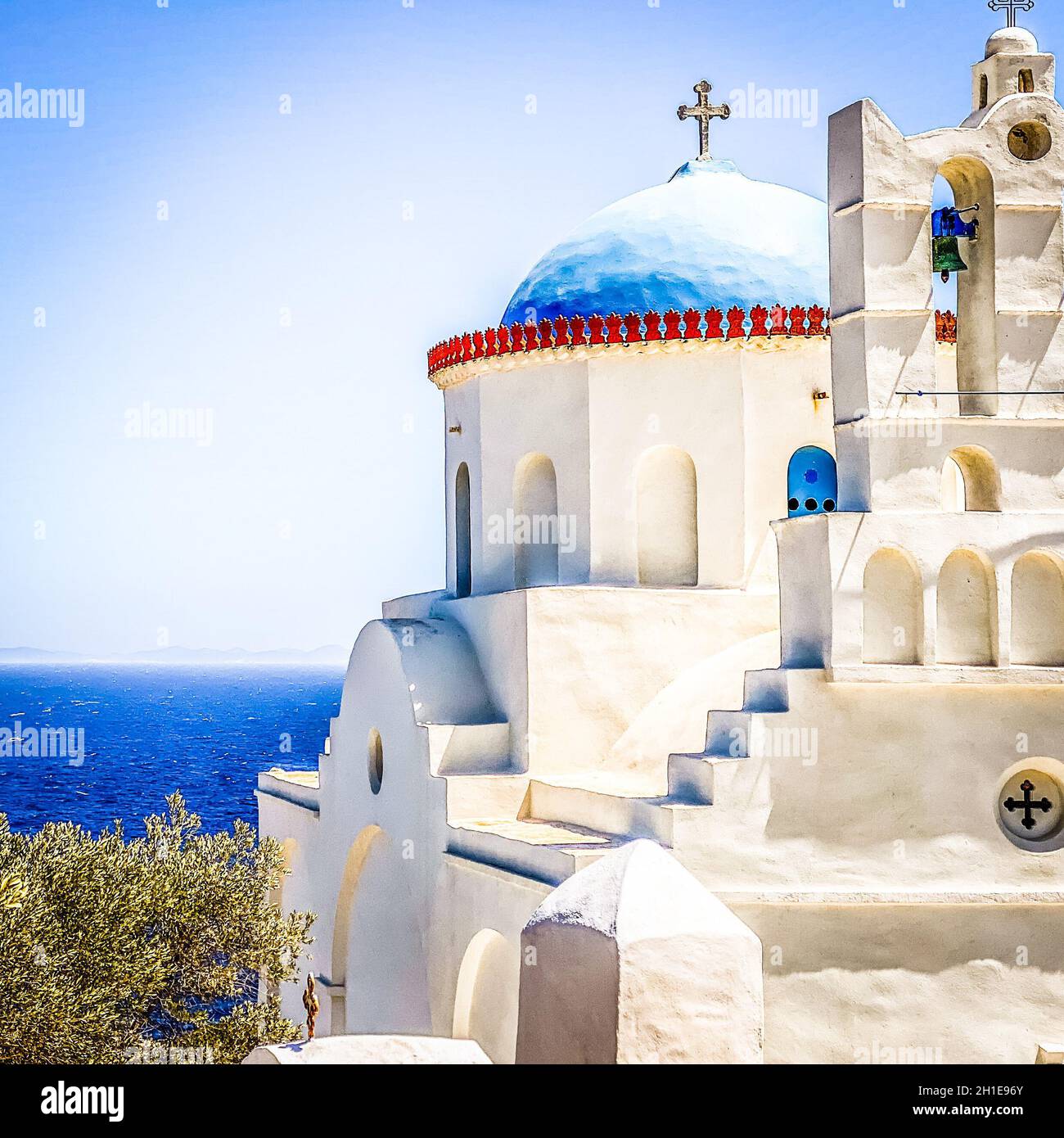 Traditional bells tower and blue dome of the orthodox white churches ...