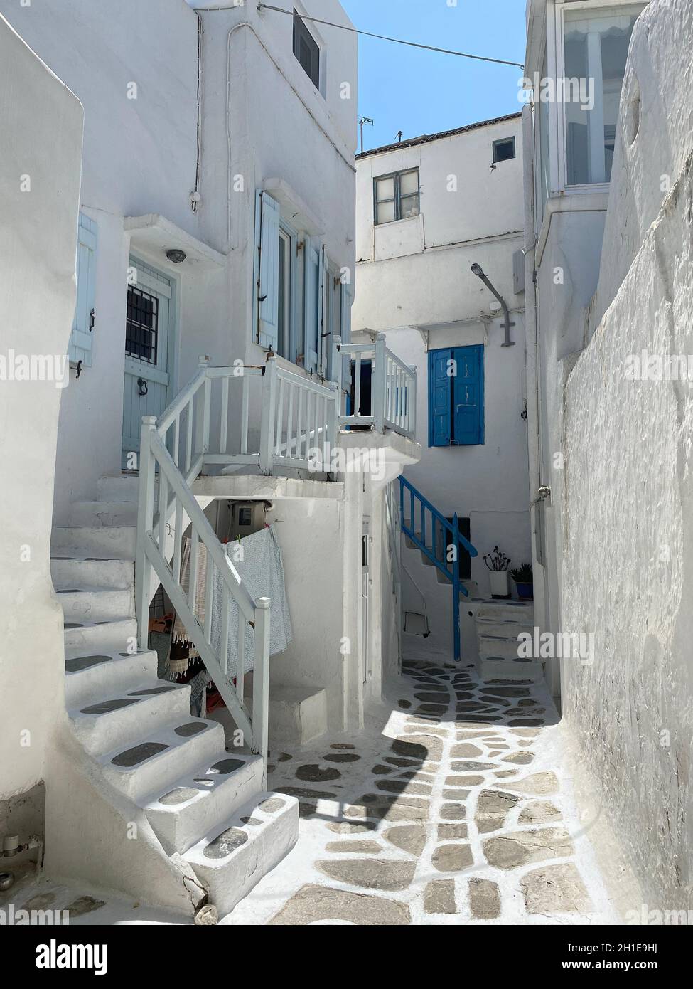 Traditional greek architecture, Stairs, whitewashed walls and blue ...
