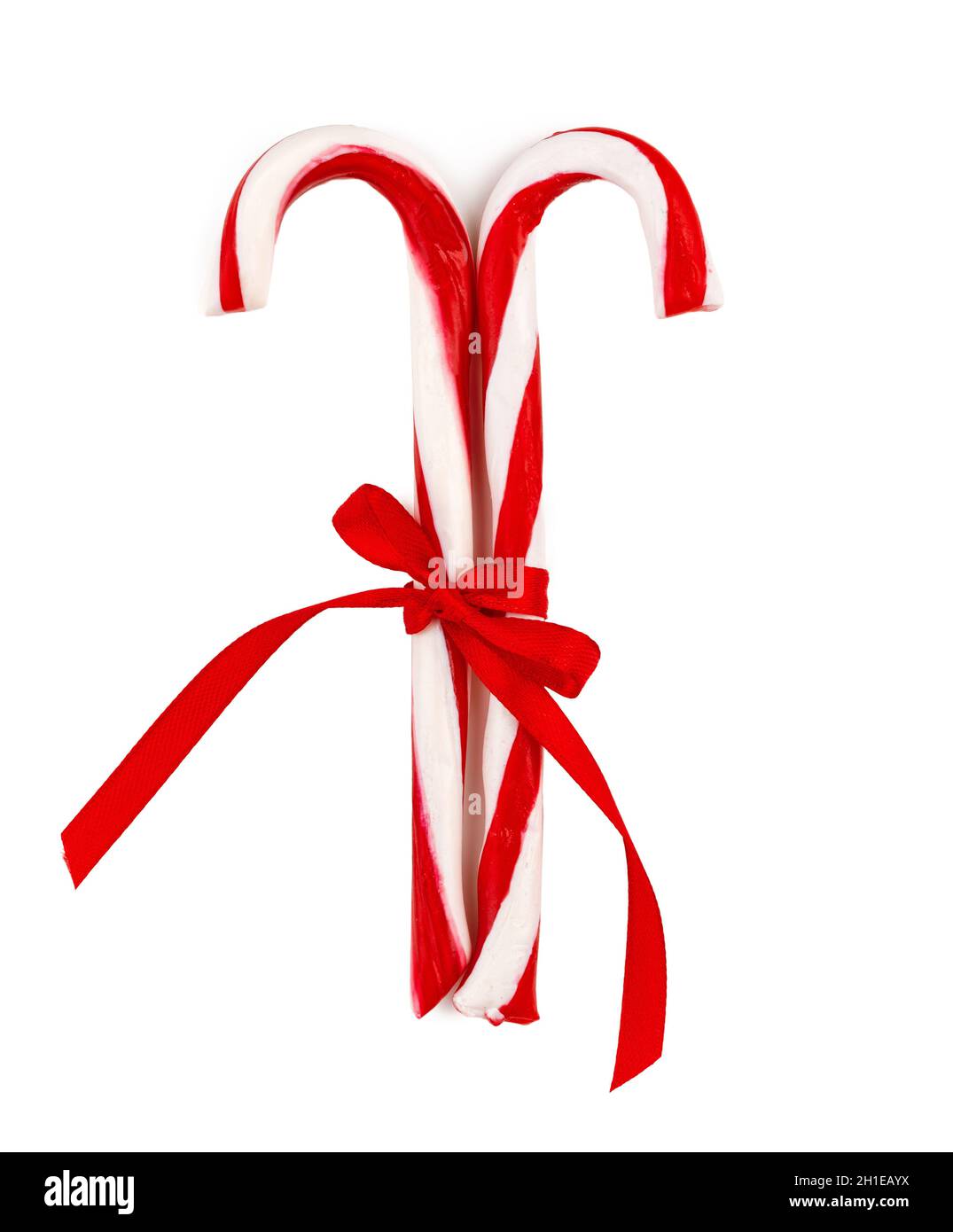 Two candy canes isolated on white background Stock Photo - Alamy