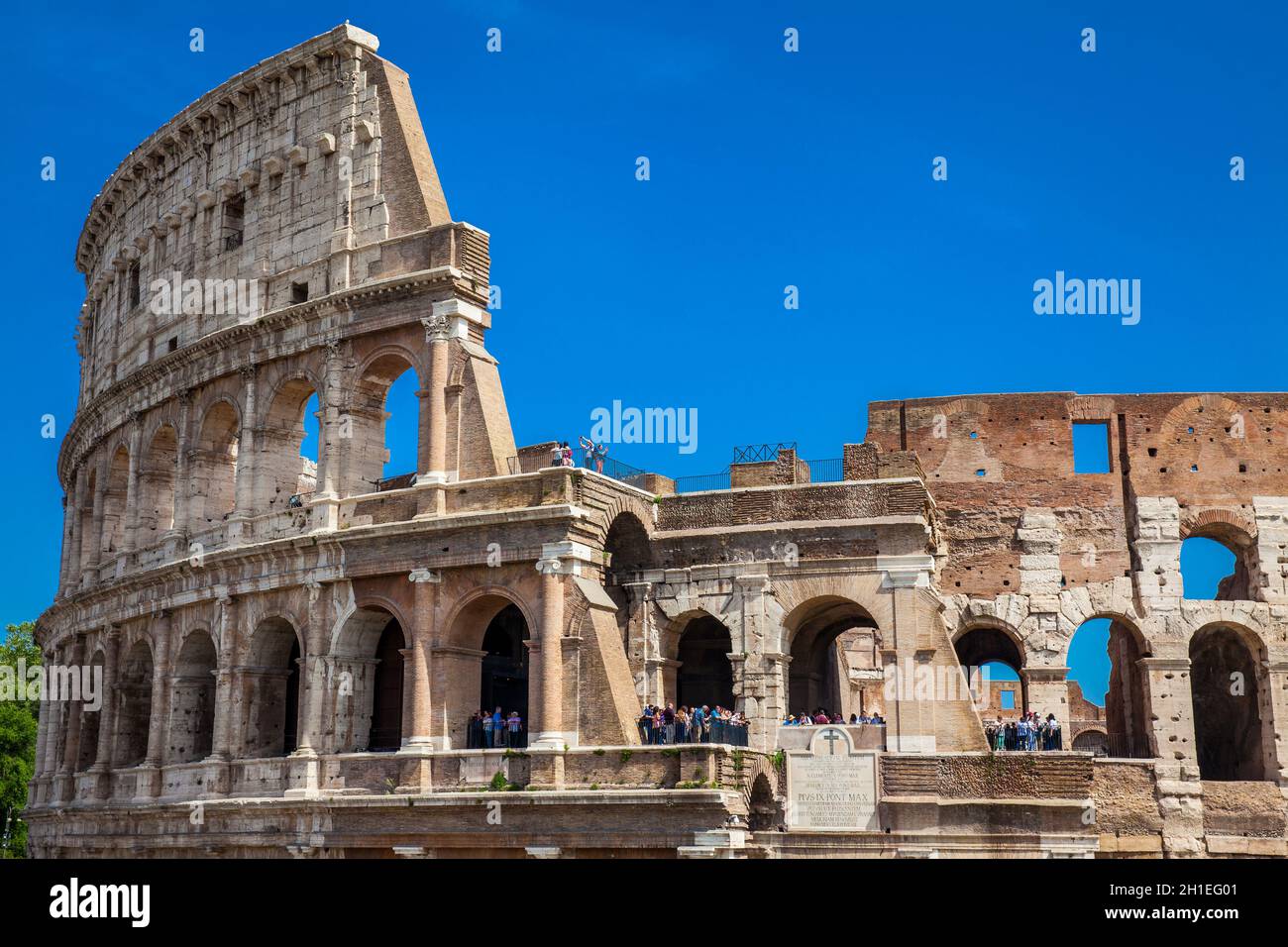 ROME, ITALY - APRIL, 2018: Tourists visiting the famous Colosseum in ...