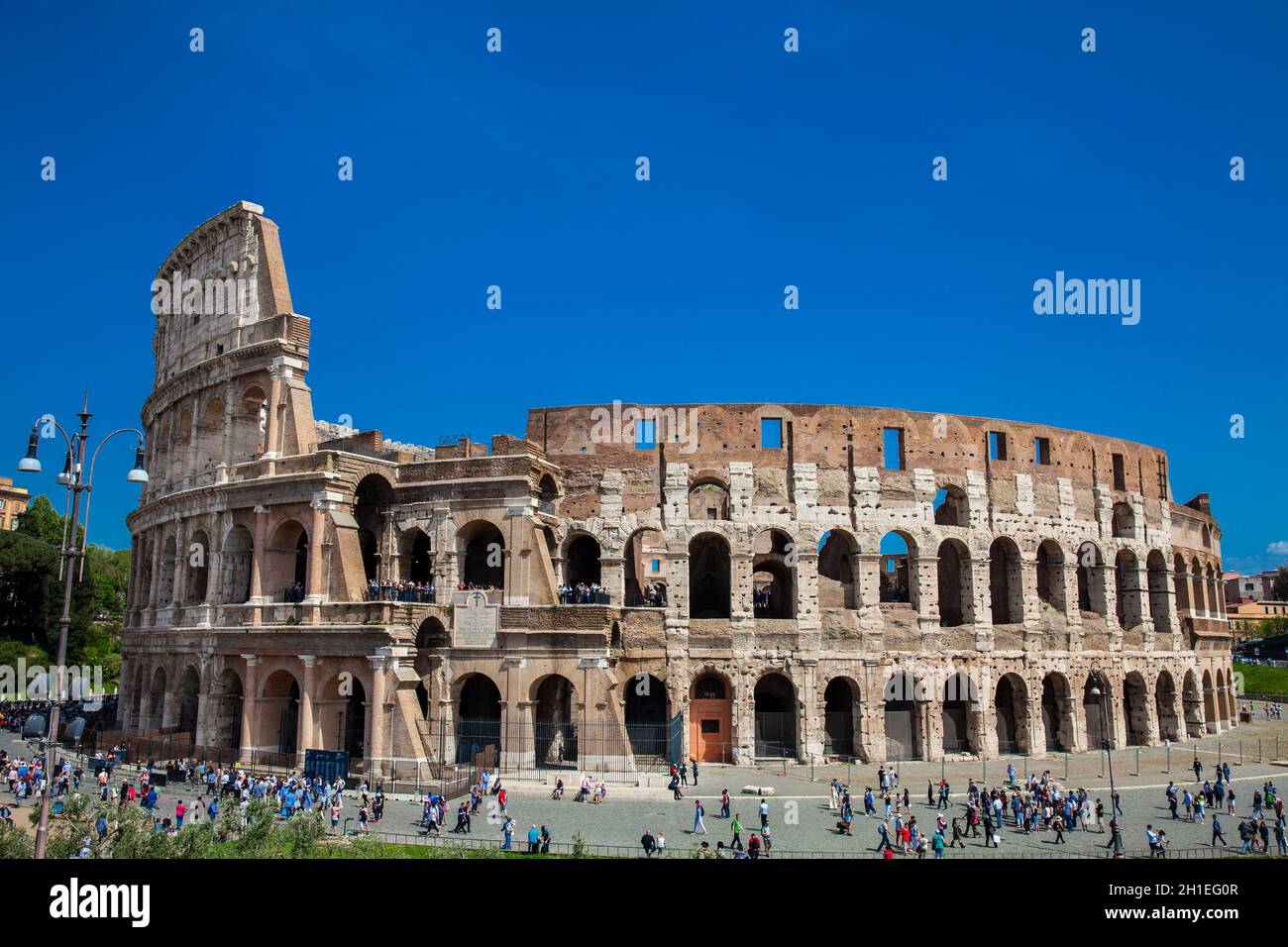 ROME, ITALY - APRIL, 2018: Tourists visiting the famous Colosseum in ...