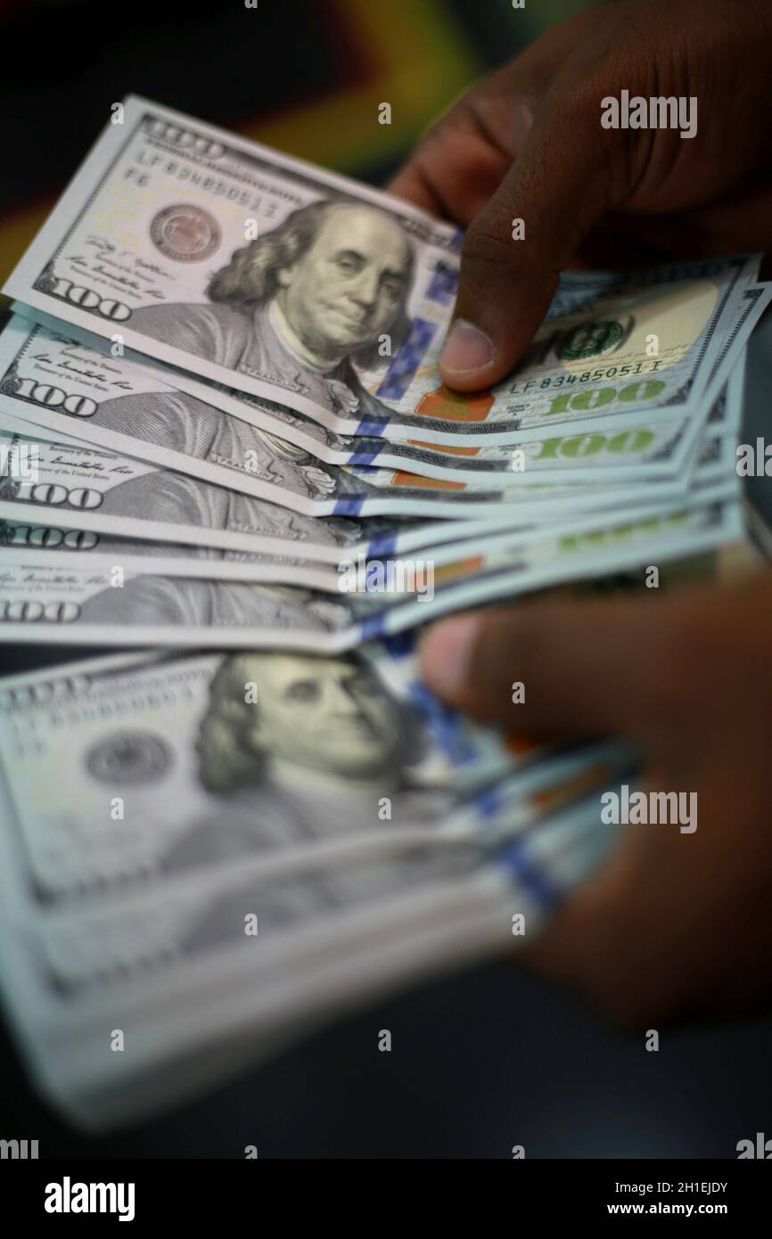 salvador, bahia / brazil - february 11, 2015: Hands hold dollar ...