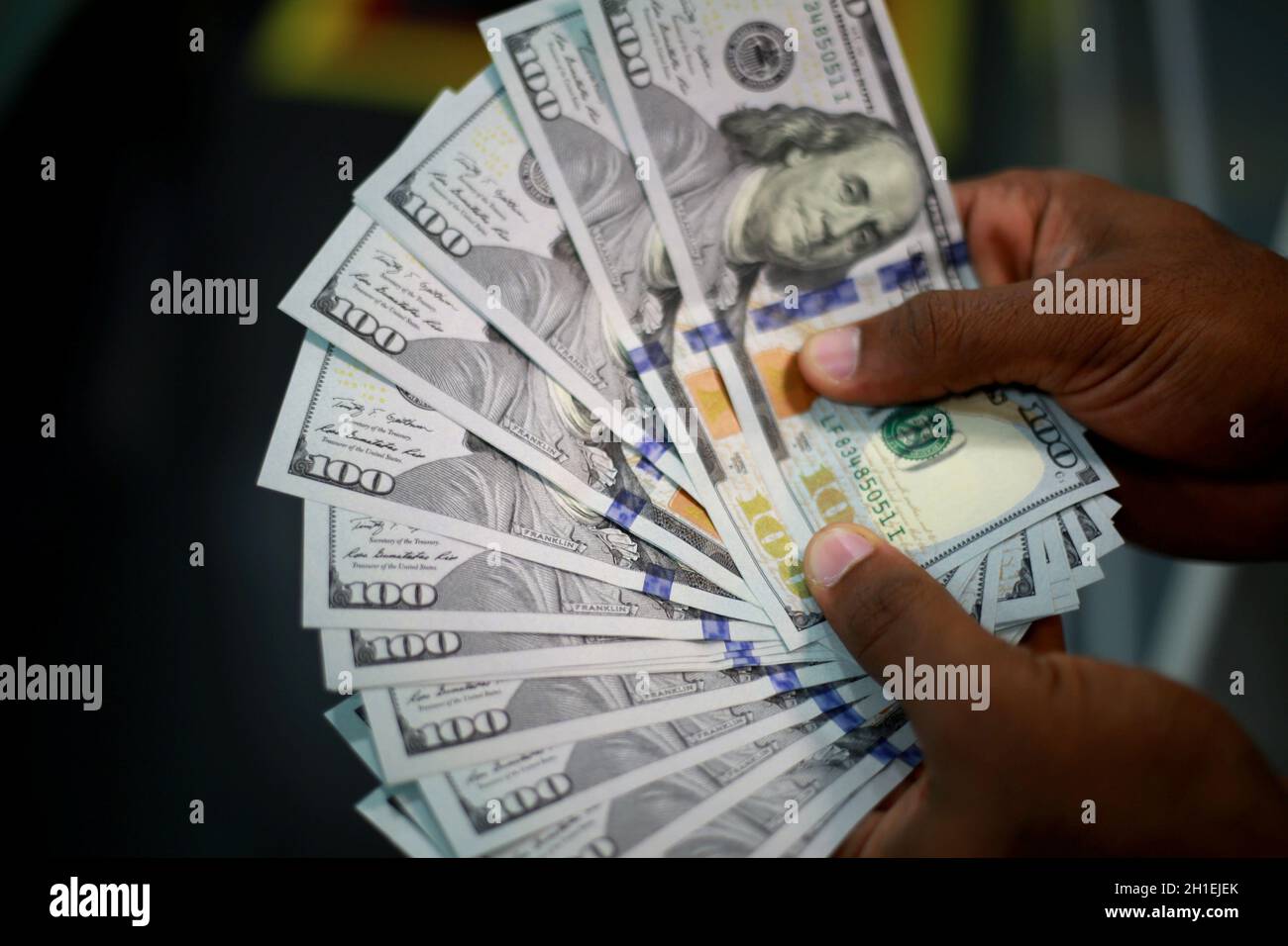 salvador, bahia / brazil - february 11, 2015: Hands hold dollar ...