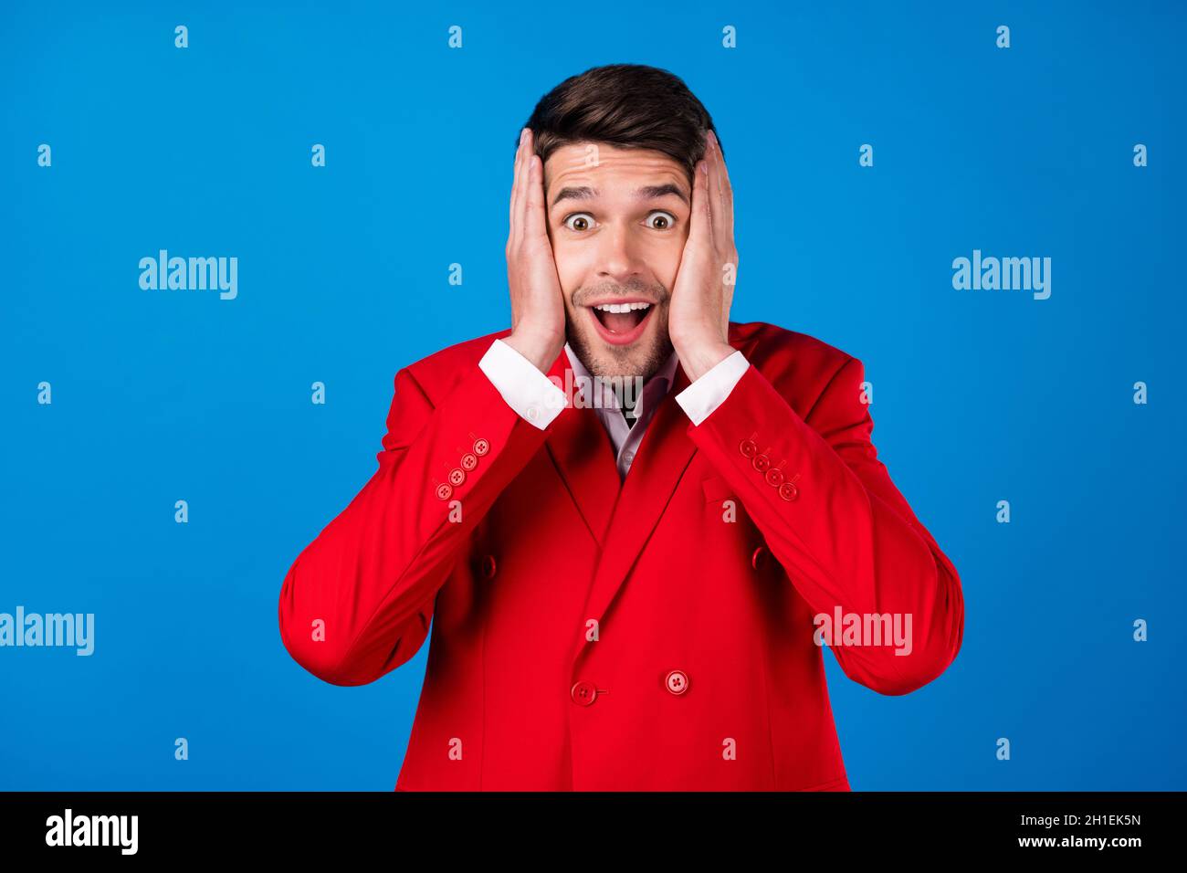 Photo of young man amazed shock hands touch cheeks news gossip rumor ...