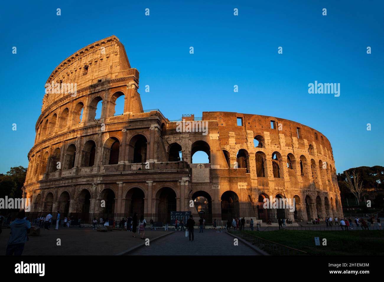 ROME, ITALY - APRIL, 2018: Tourists visiting the famous Colosseum under ...