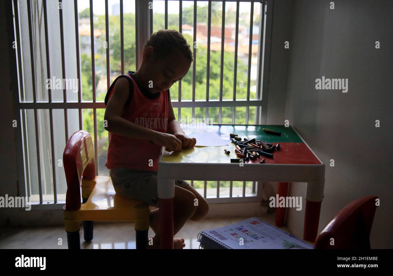 salvador, bahia / brazil - may 15, 2020: child is seen doing school ...