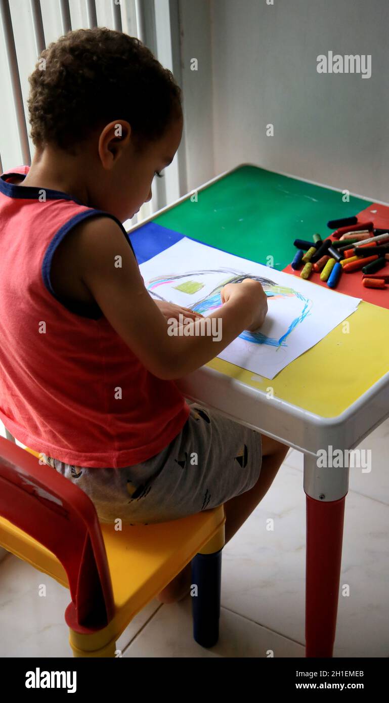 salvador, bahia / brazil - may 15, 2020: child is seen doing school ...
