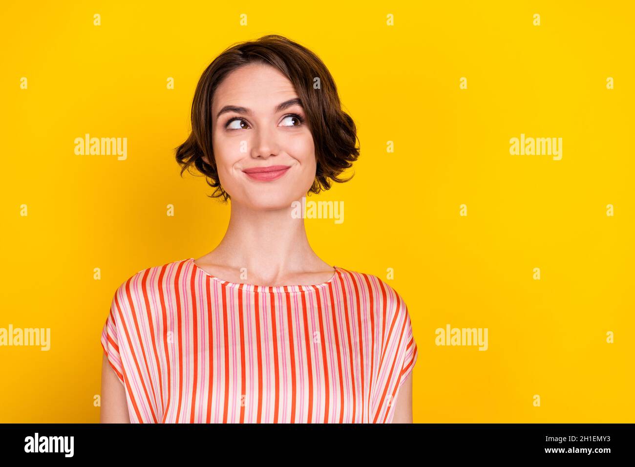 Photo of cheerful young happy positive woman look empty space smile ...