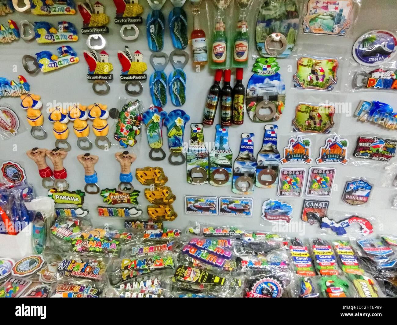 Ethnic souvenir magnets, baseball caps, bags with various pattern ...
