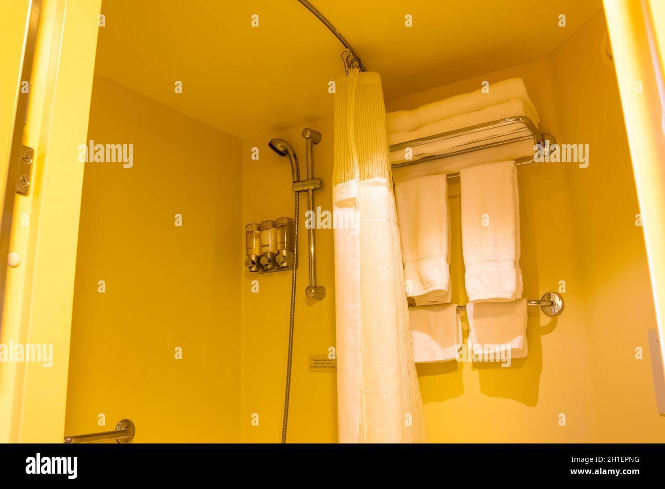 Bathroom with shower cabin, toilet on a cruise ship. Interior of inside ...