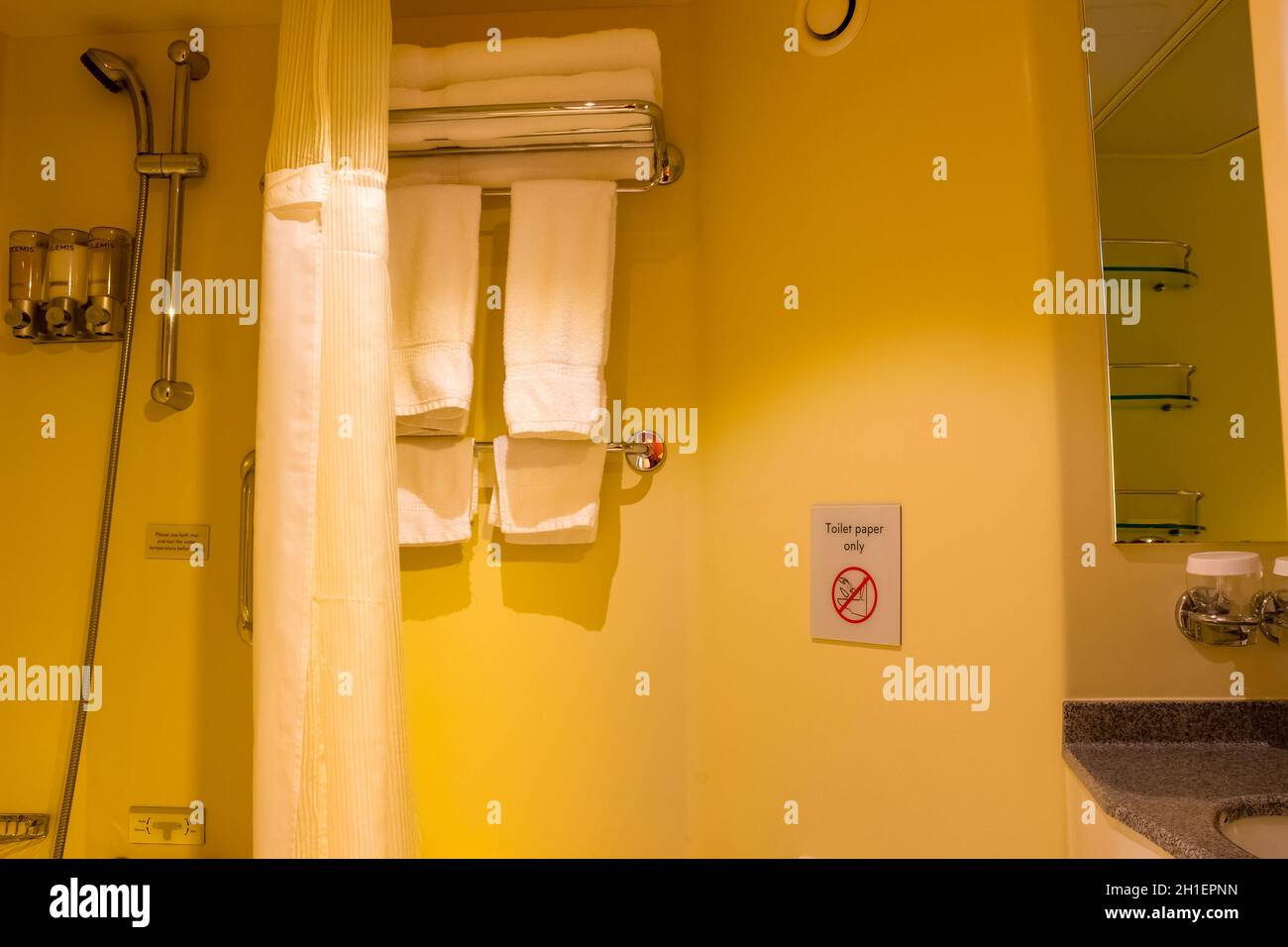 Bathroom with shower cabin, toilet on a cruise ship. Interior of inside ...