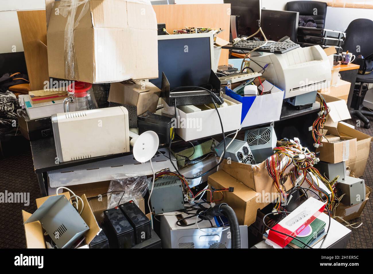 A messy desktop with stacks of files and other documents, all kind of ...