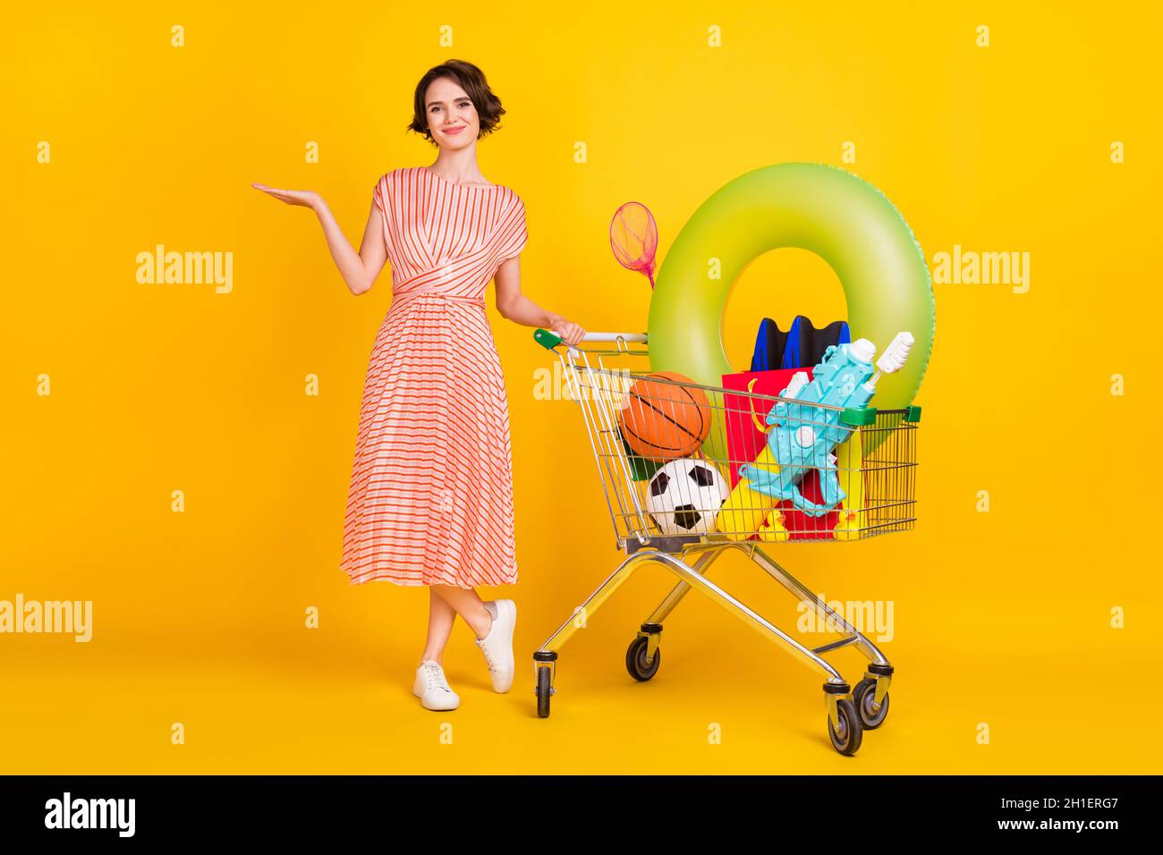 Photo of promoter girl hold cart sports goods hand hold empty space ...