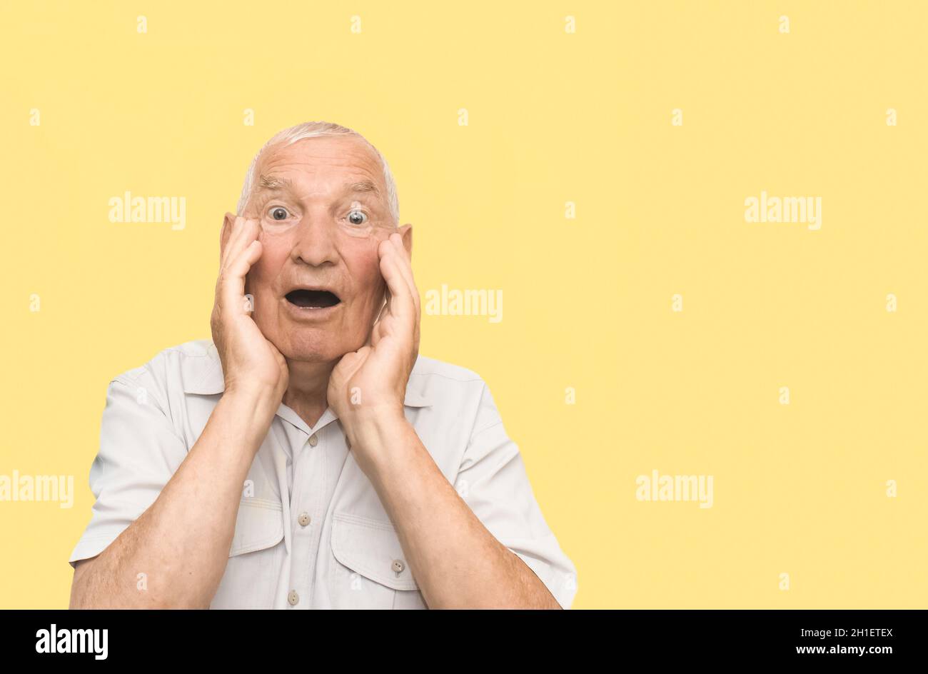 The old man with a emotions on a color studio background Stock Photo ...